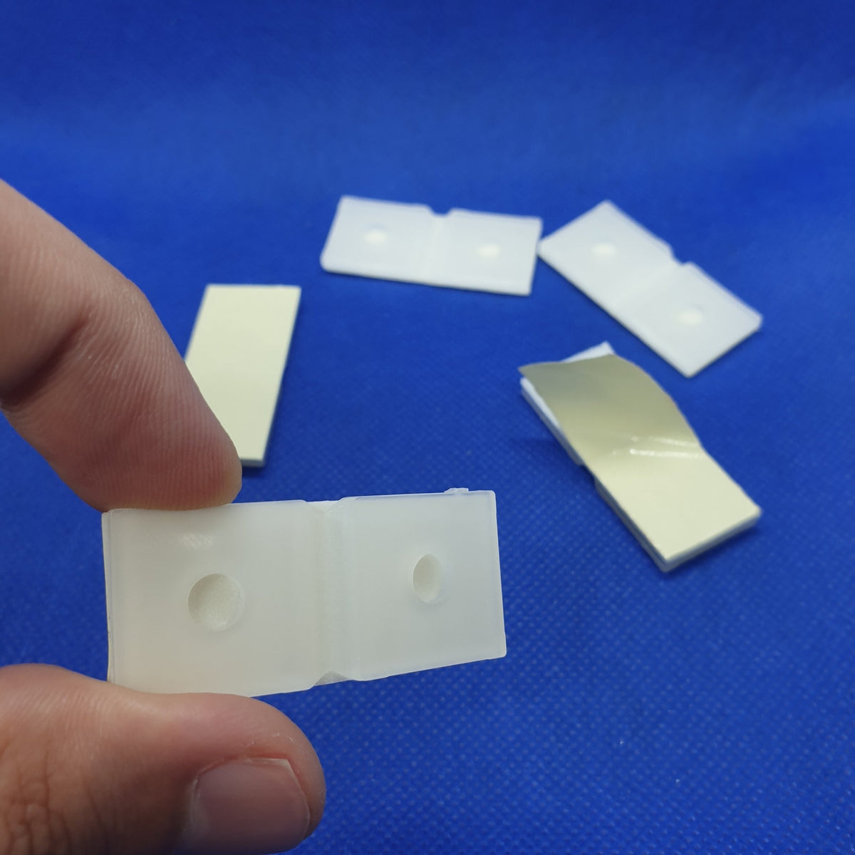 Plastic Hinge with Adhesive and Holes COR14 — Hang and Display