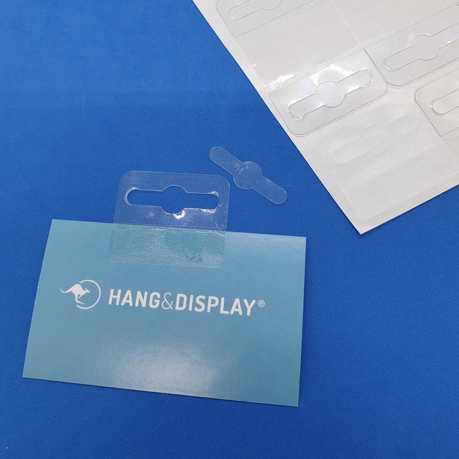 Self Adhesive Hang Tabs Euro Slot on Sheet REF-55429 — Hang and Display