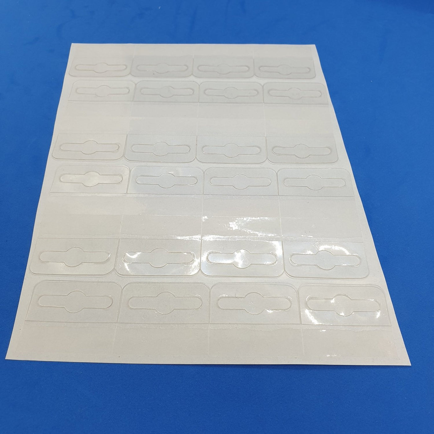 Self Adhesive Hang Tabs Euro Slot on Sheet REF-55429 — Hang and Display