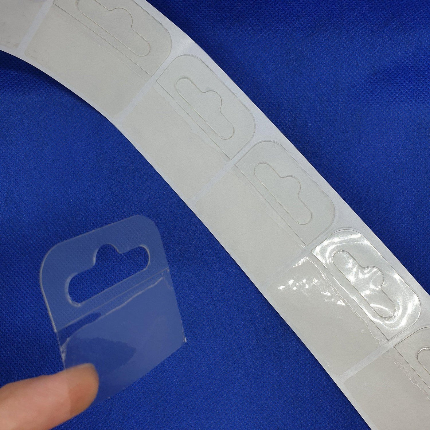 Self Adhesive Hang Tabs Flexi Euro Slot on Reel REF-360 — Hang and Display