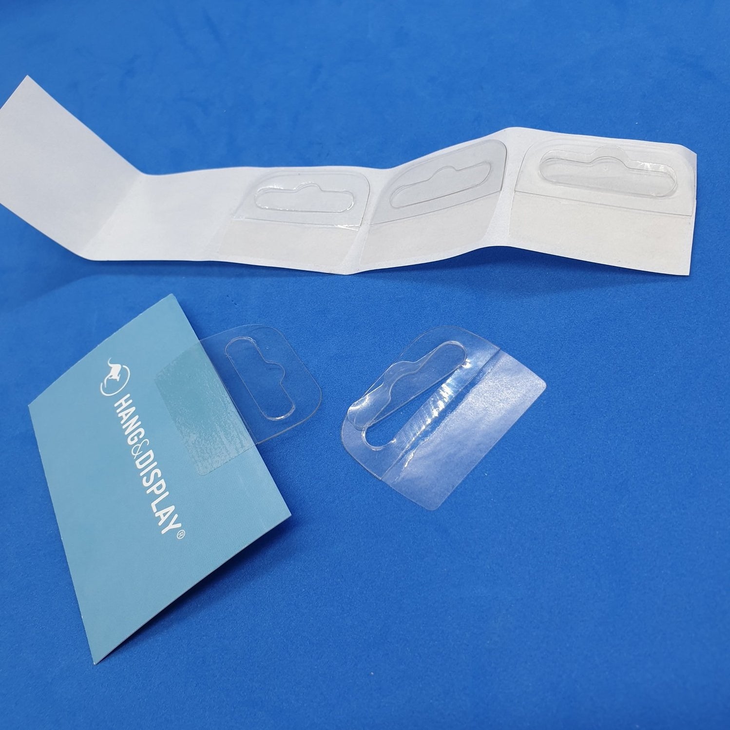 Self Adhesive Hang Tabs Flexi Euro Slot on Reel REF-364 — Hang and Display