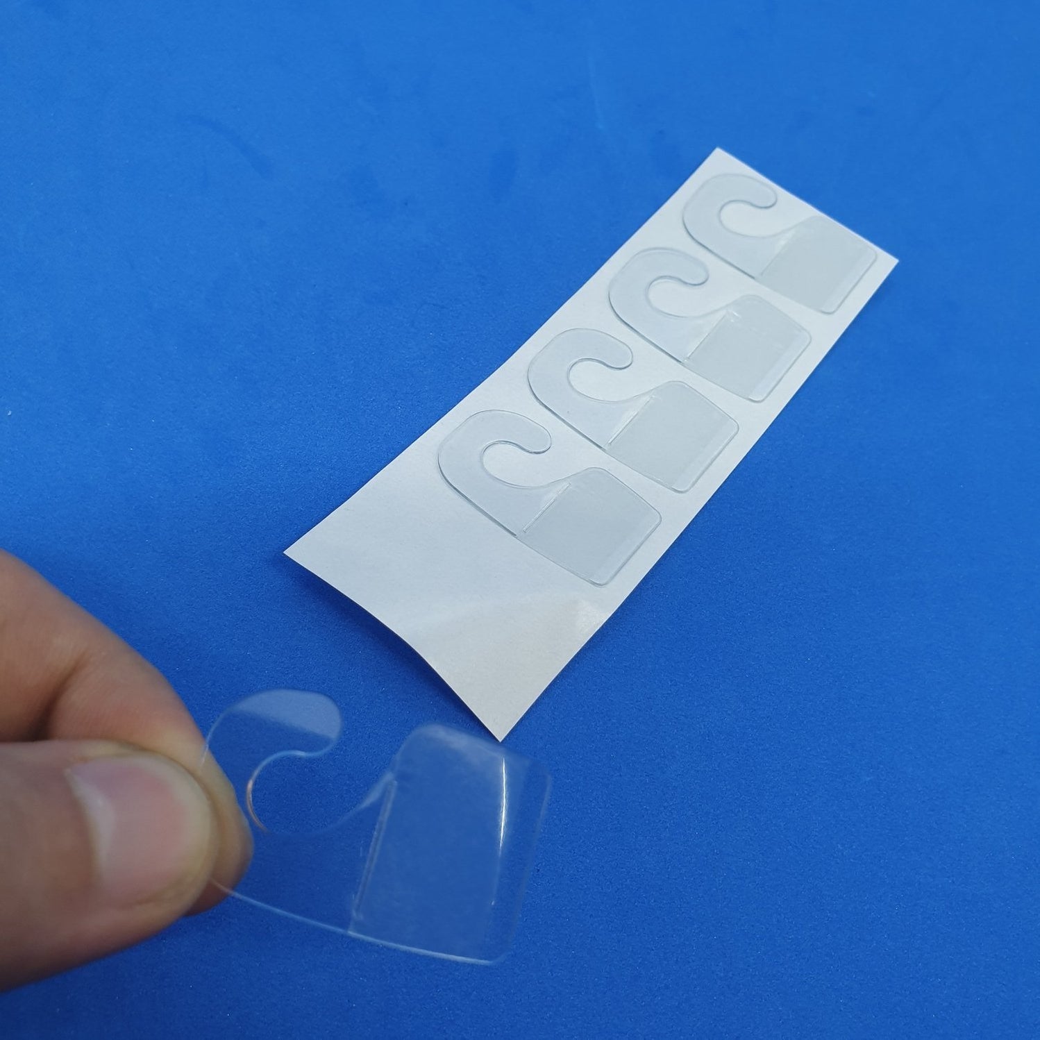 Self Adhesive Hang Tabs with Open Hook on Reel BLI394 — Hang and Display